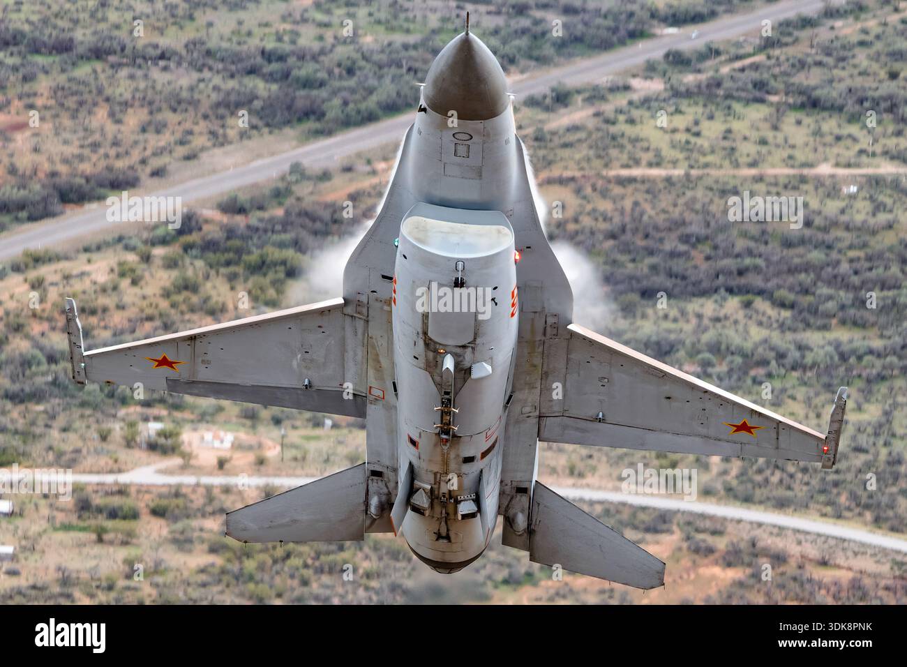 A General Dynamics F-16A Netz operated by Top Aces flies in an air-to ...