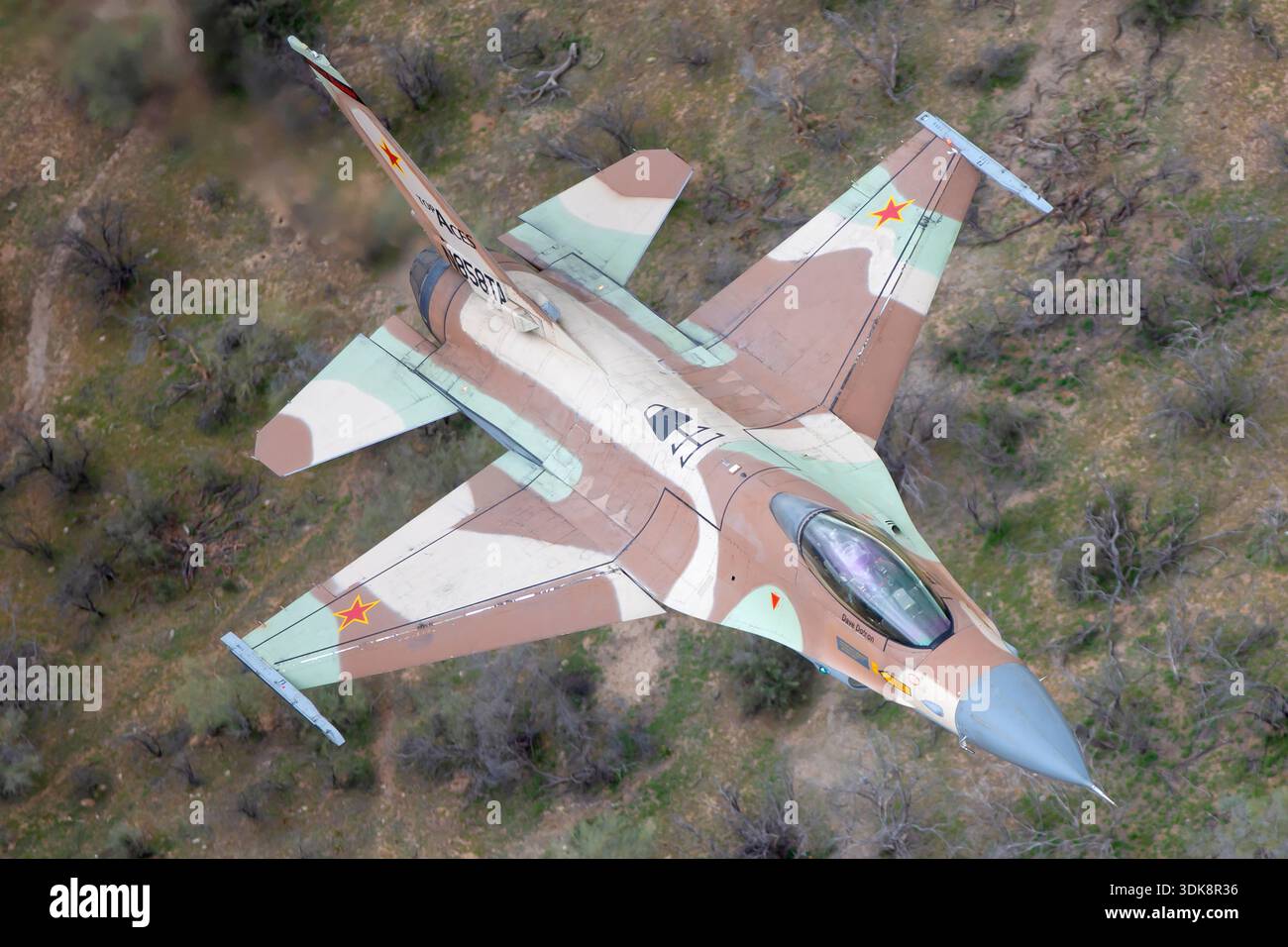 An overhead air-to-air view shows a General Dynamics F-16A Netz ...
