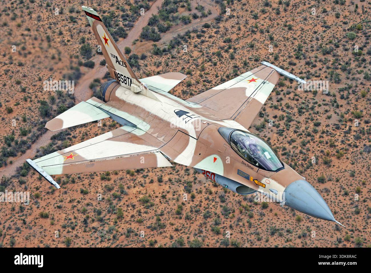An overhead air-to-air view shows a General Dynamics F-16A Netz ...