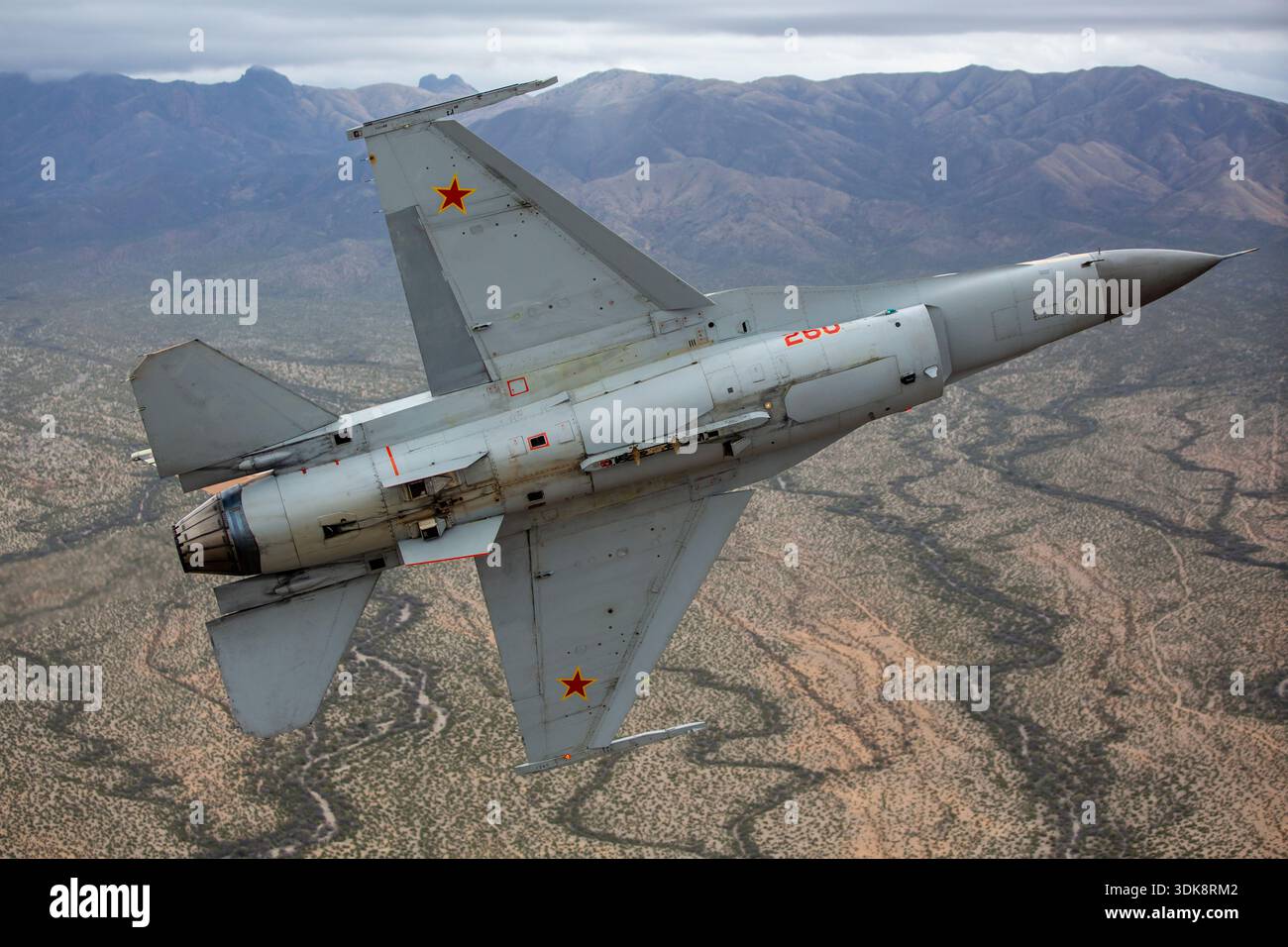 The General Dynamics F-16A Netz from Top Aces is depicted banking in ...
