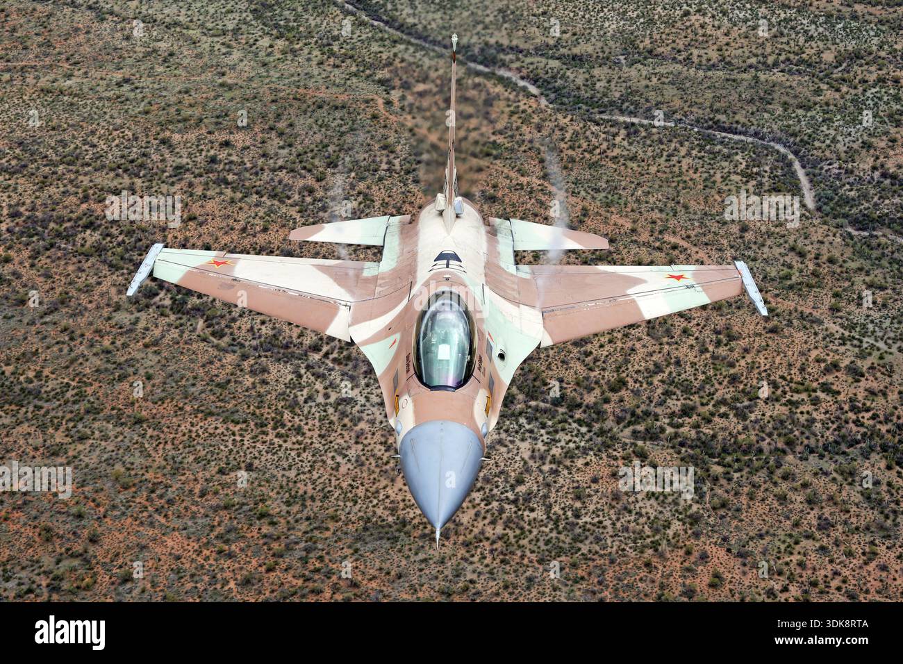 A close air-to-air view captures a General Dynamics F-16A Netz ...