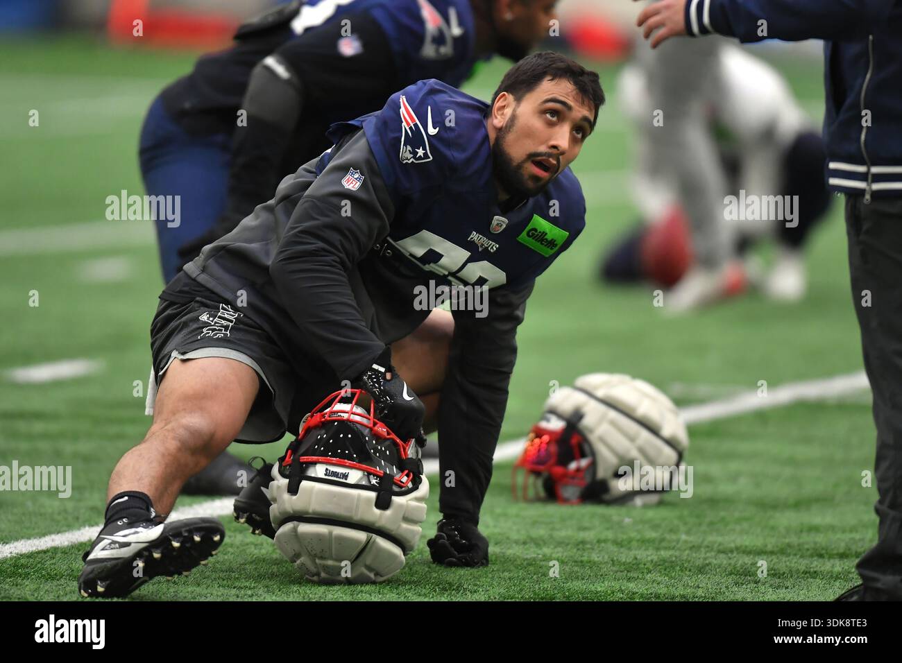 New England Patriots linebacker Christian Elliss warms up during an NFL ...