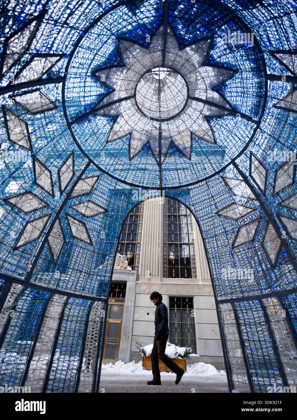 A man walks by a winter display in downtown Ottawa, Friday, Jan. 30 ...