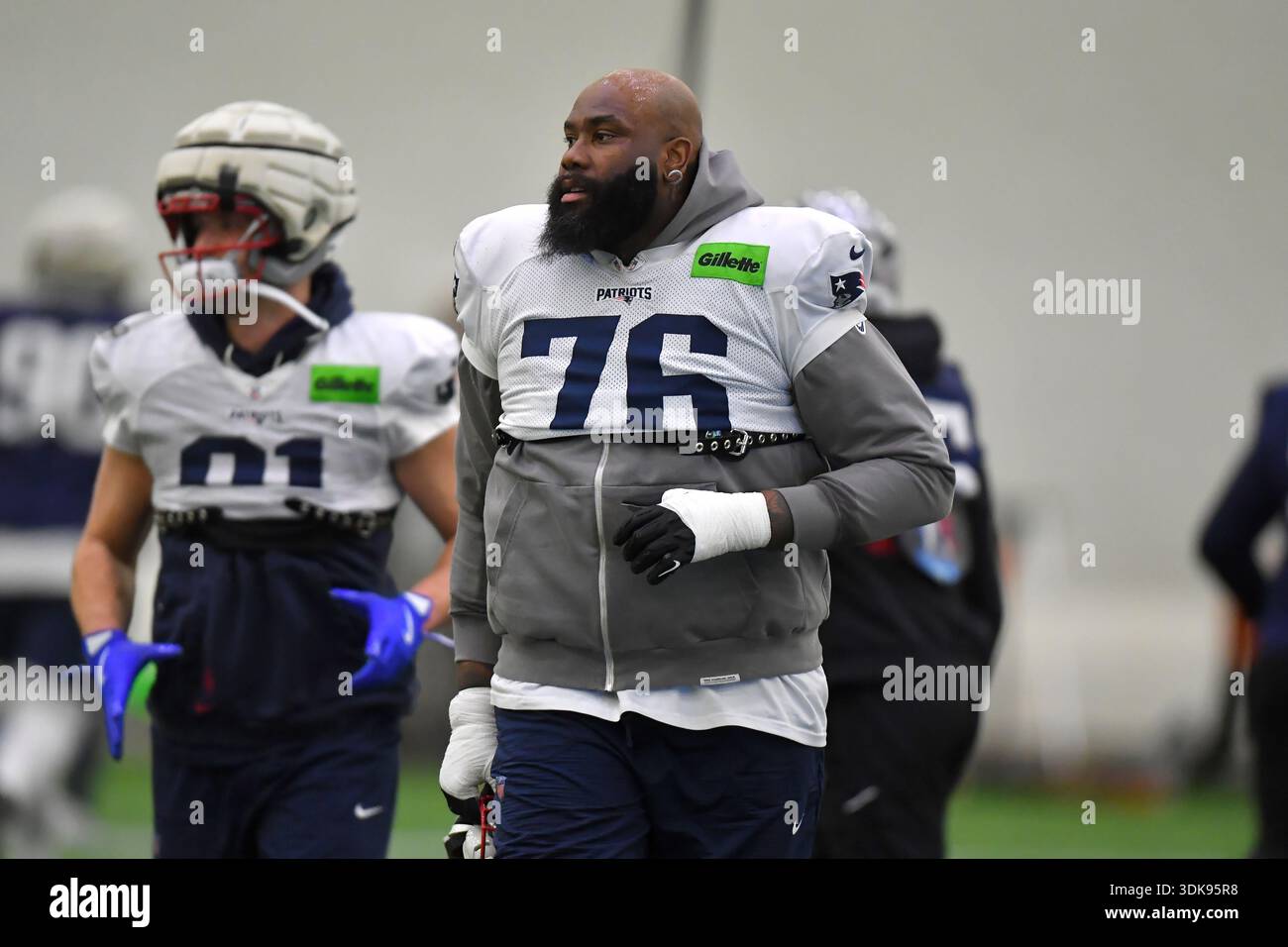 New England Patriots offensive tackle Morgan Moses (76) warms up during ...
