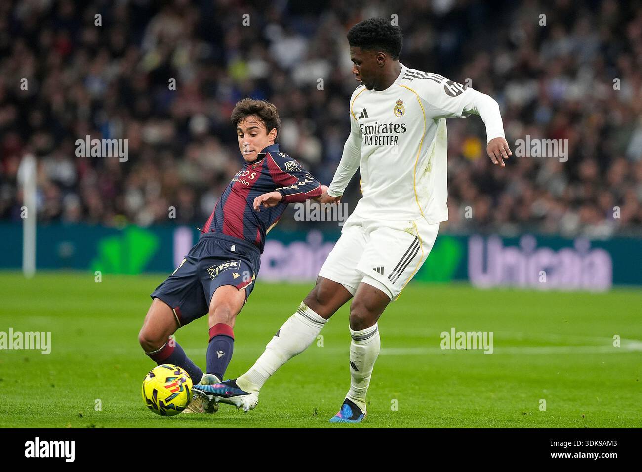 Real Madrid CF’s Aurelien Tchouameni (r) and Levante UD's Manu Sanchez ...