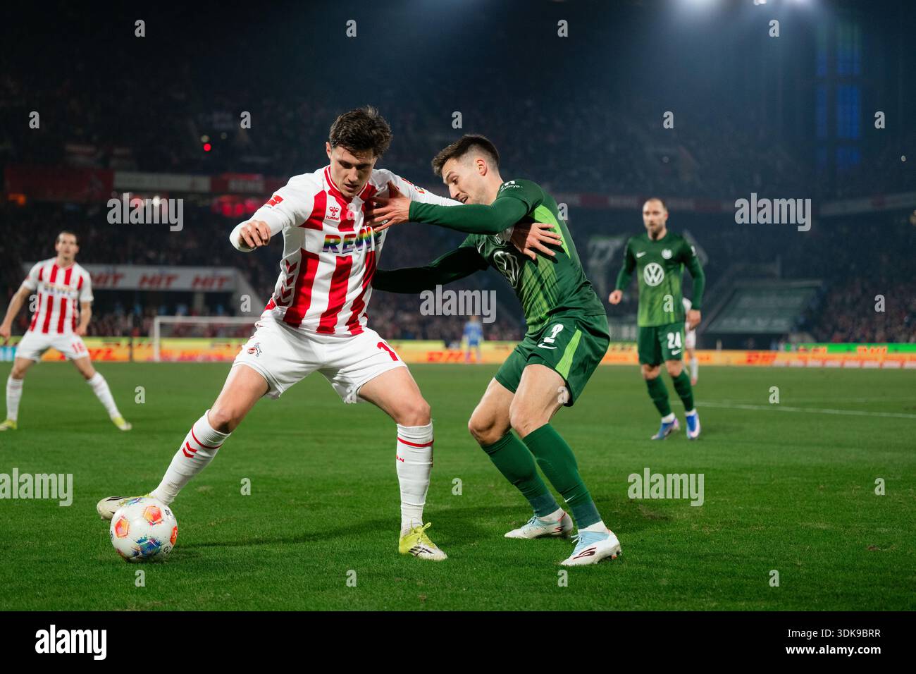 Cologne's Alessio Castro-Montes, left, and Wolfsburg's Kilian Fischer ...