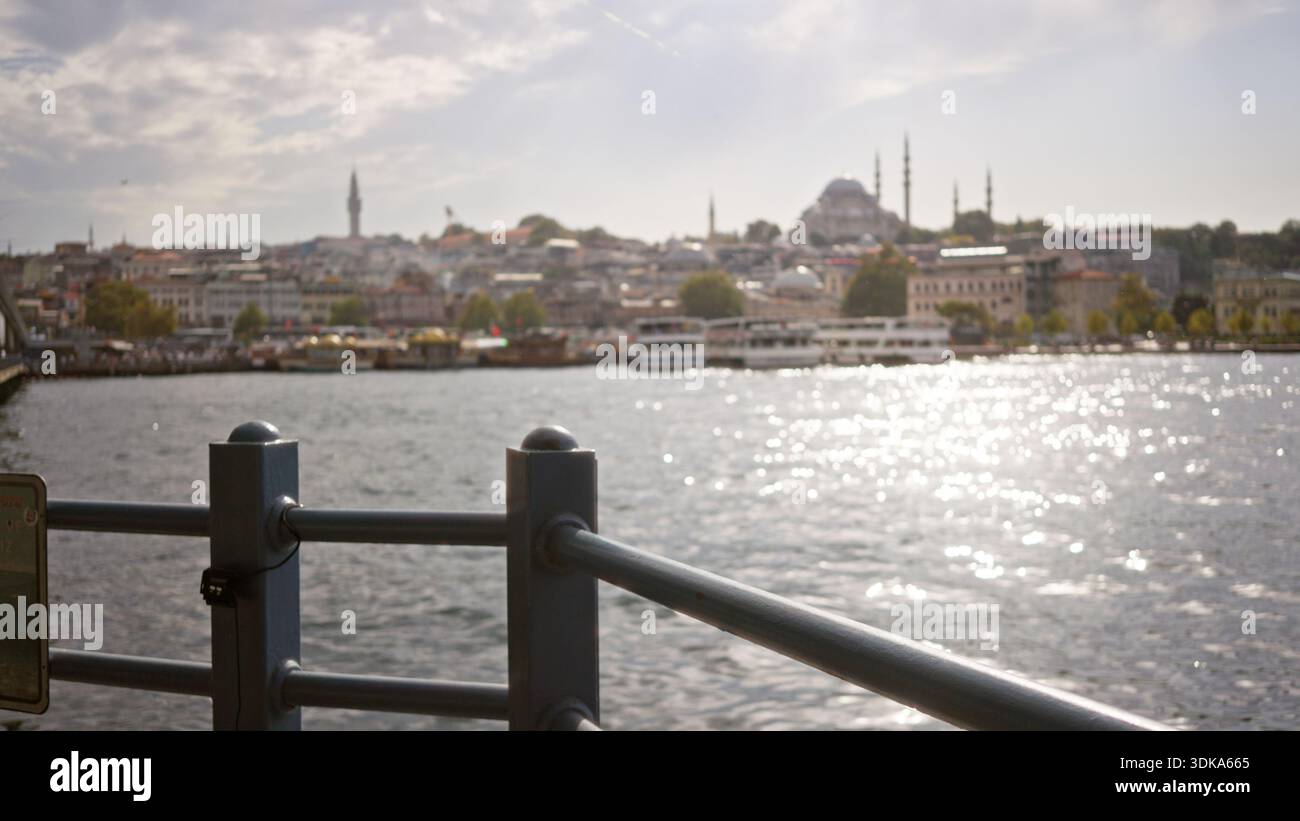 Harbor railing and distant skyline rendered in shallow bokeh exterior ...