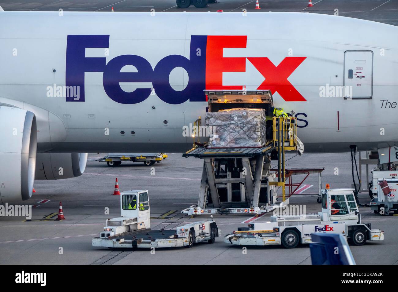 FedEx Express Boeing 777-FS2 cargo aircraft being unloaded, air freight ...