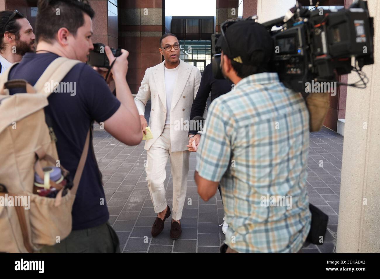 Journalist Don Lemon, center, leaves a hearing at the Edward R. Roybal ...