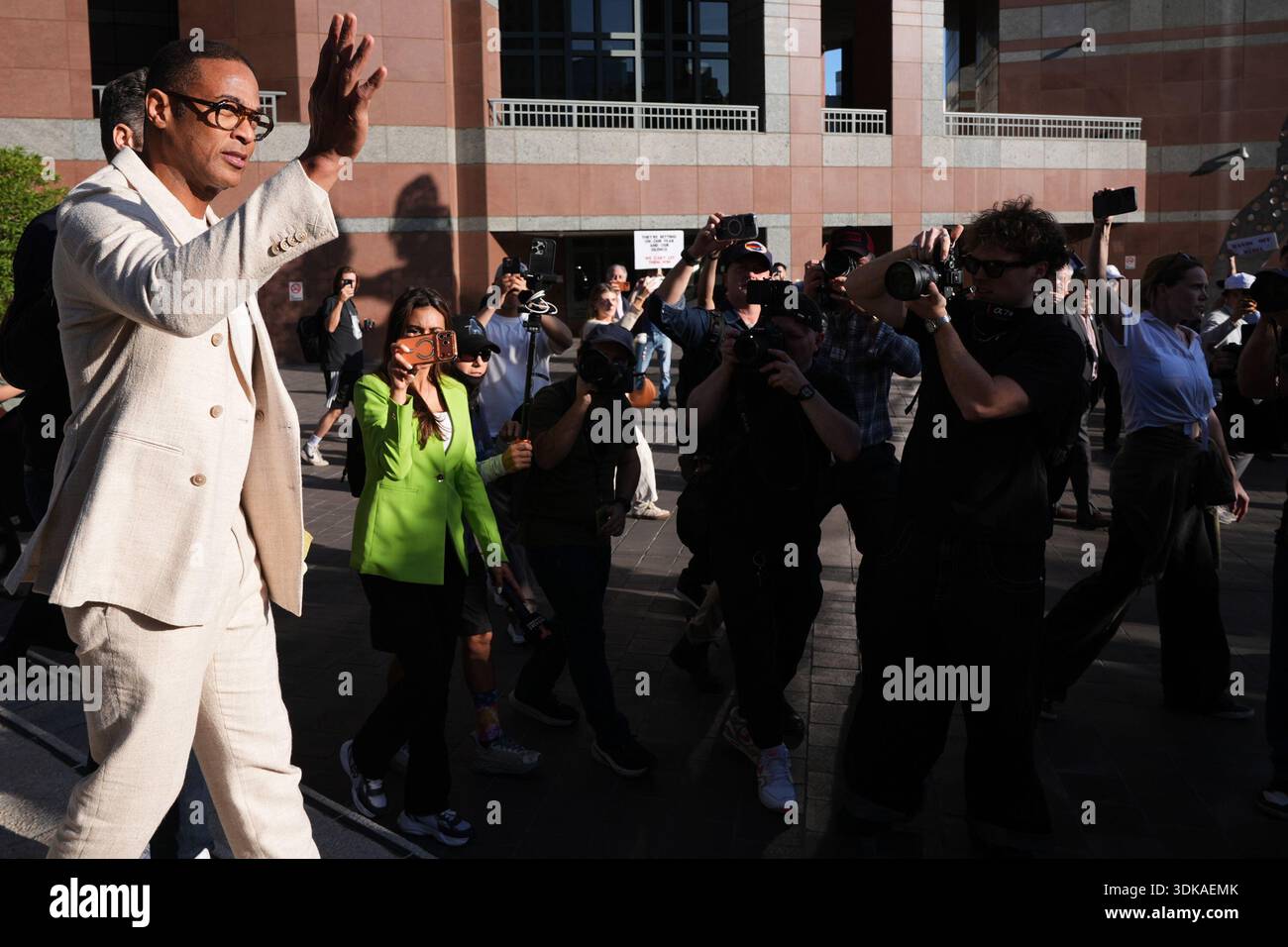 Journalist Don Lemon, waves after leaving a hearing at the Edward R ...