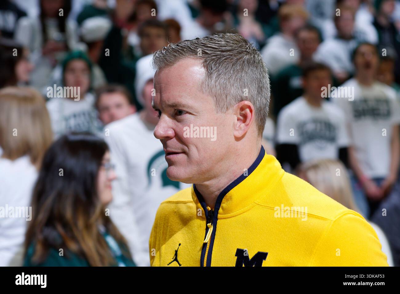 Michigan coach Dusty May walks off the court before an NCAA college ...