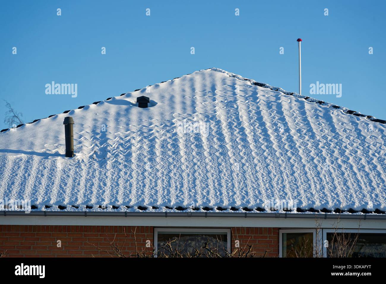 Snow covered residential roof after winter storm Elli Goretti on ...
