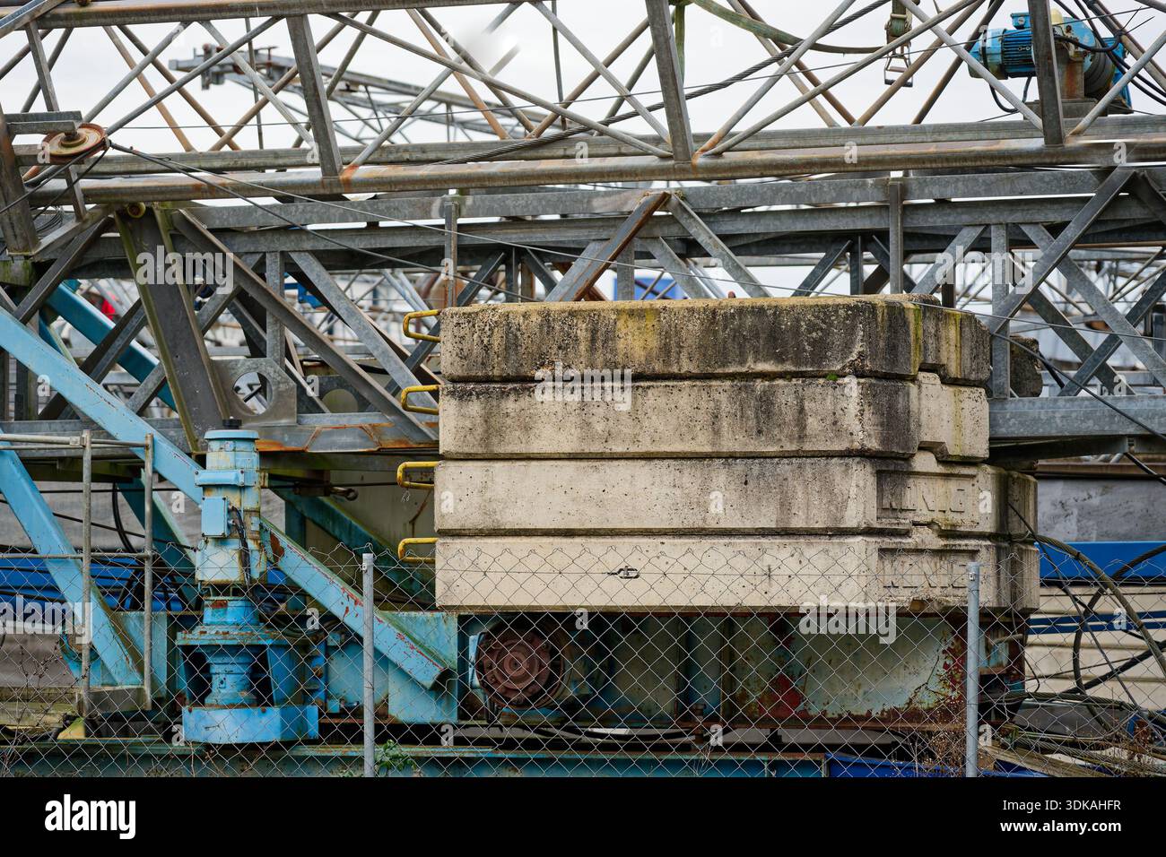 An industrial metal framework braces heavy concrete slabs, showing ...