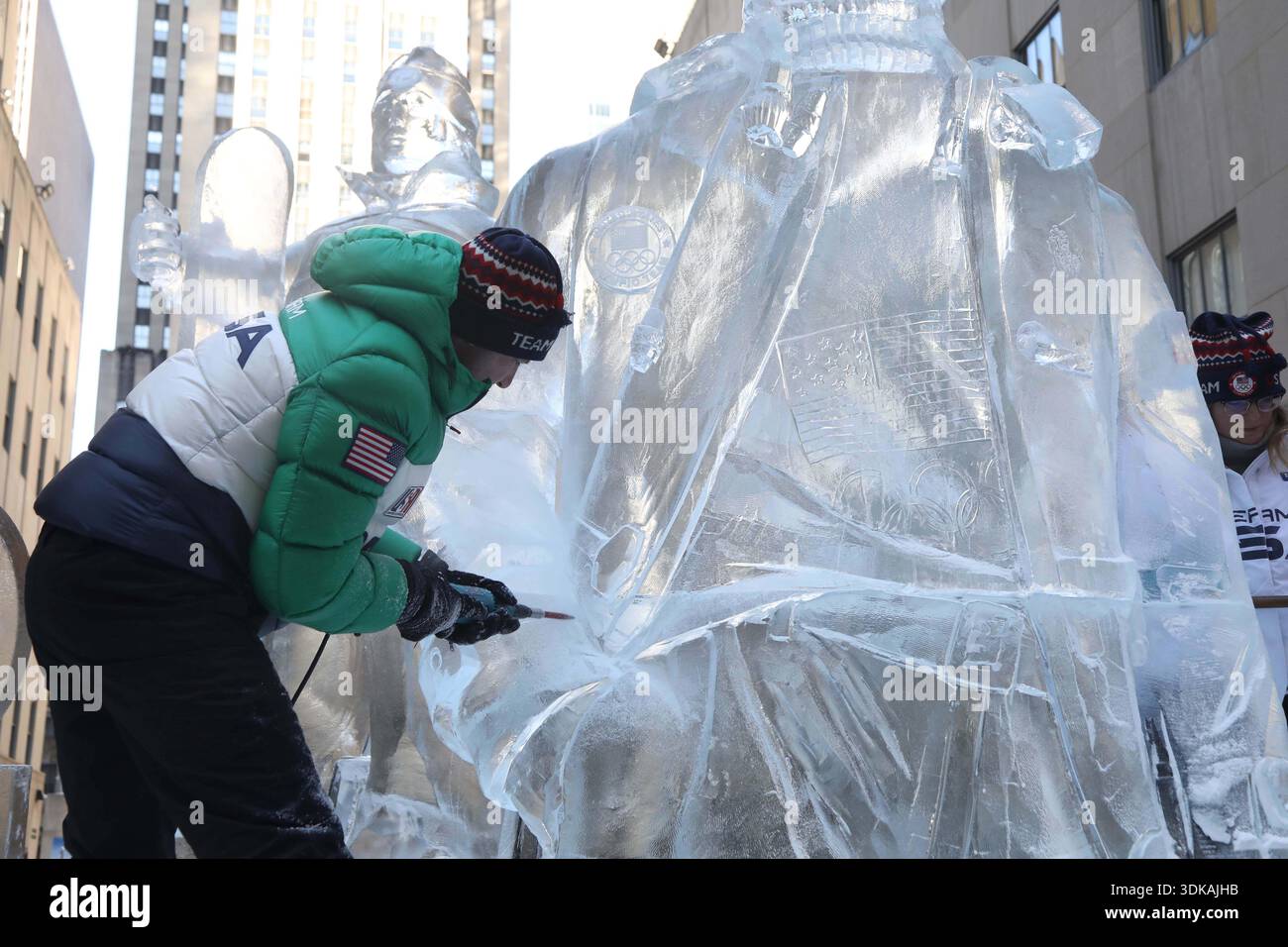 New York, New York, USA. 30th Jan, 2026. An ice sculptor add finishing ...