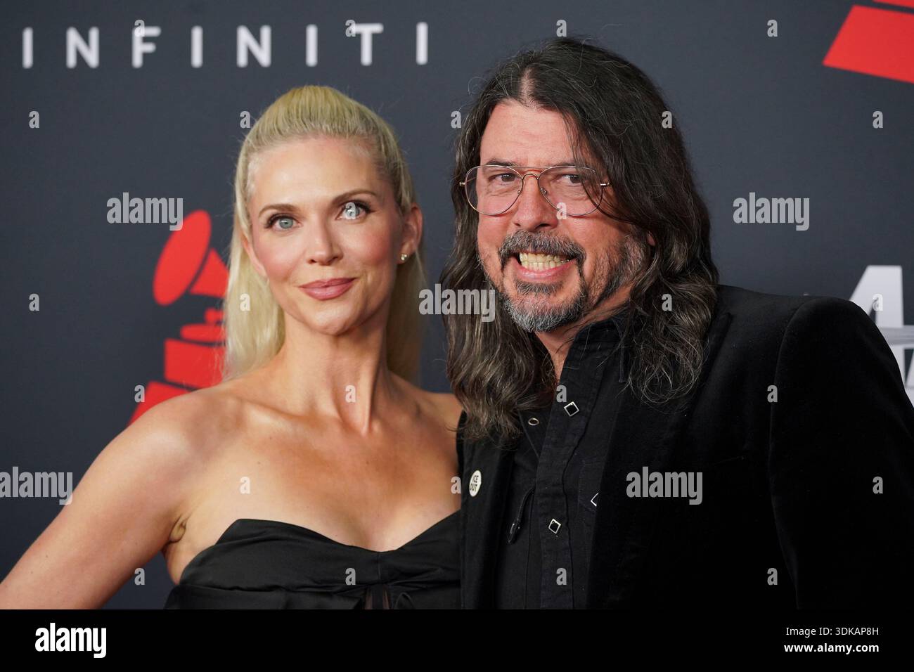 Jordyn Blum, left, and Dave Grohl arrive at MusiCares Person of the ...