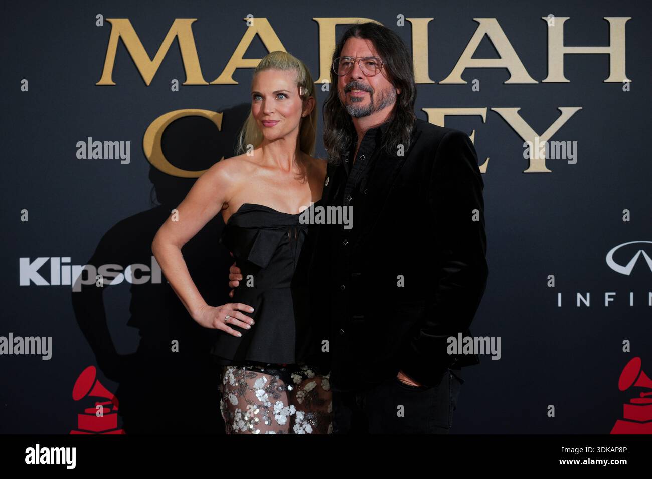 Jordyn Blum, left, and Dave Grohl arrive at MusiCares Person of the ...