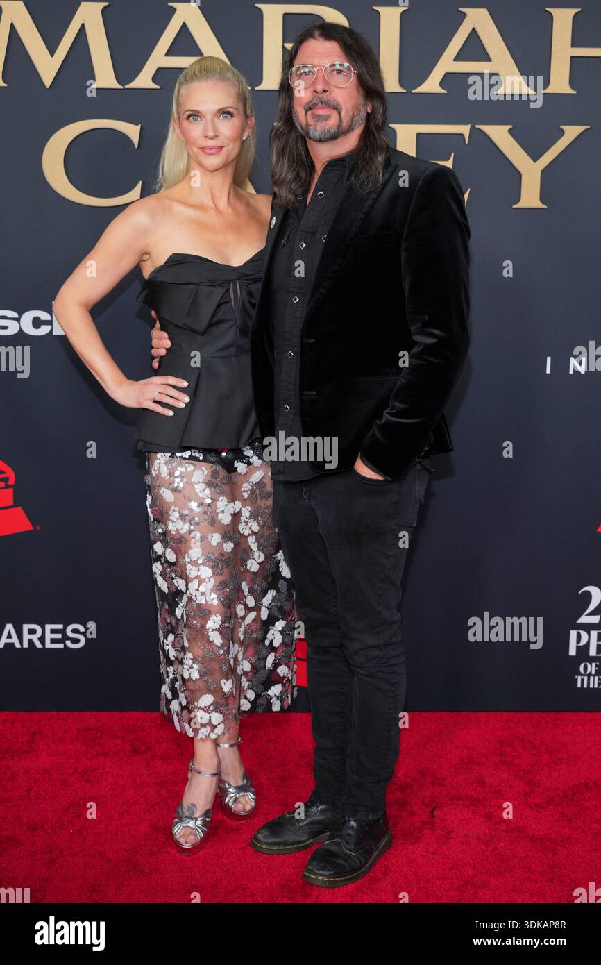 Jordyn Blum, left, and Dave Grohl arrive at MusiCares Person of the ...