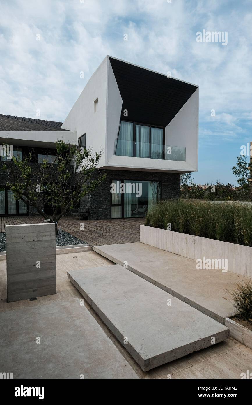 Vertical architectural photography of a sharp, angular modern white ...