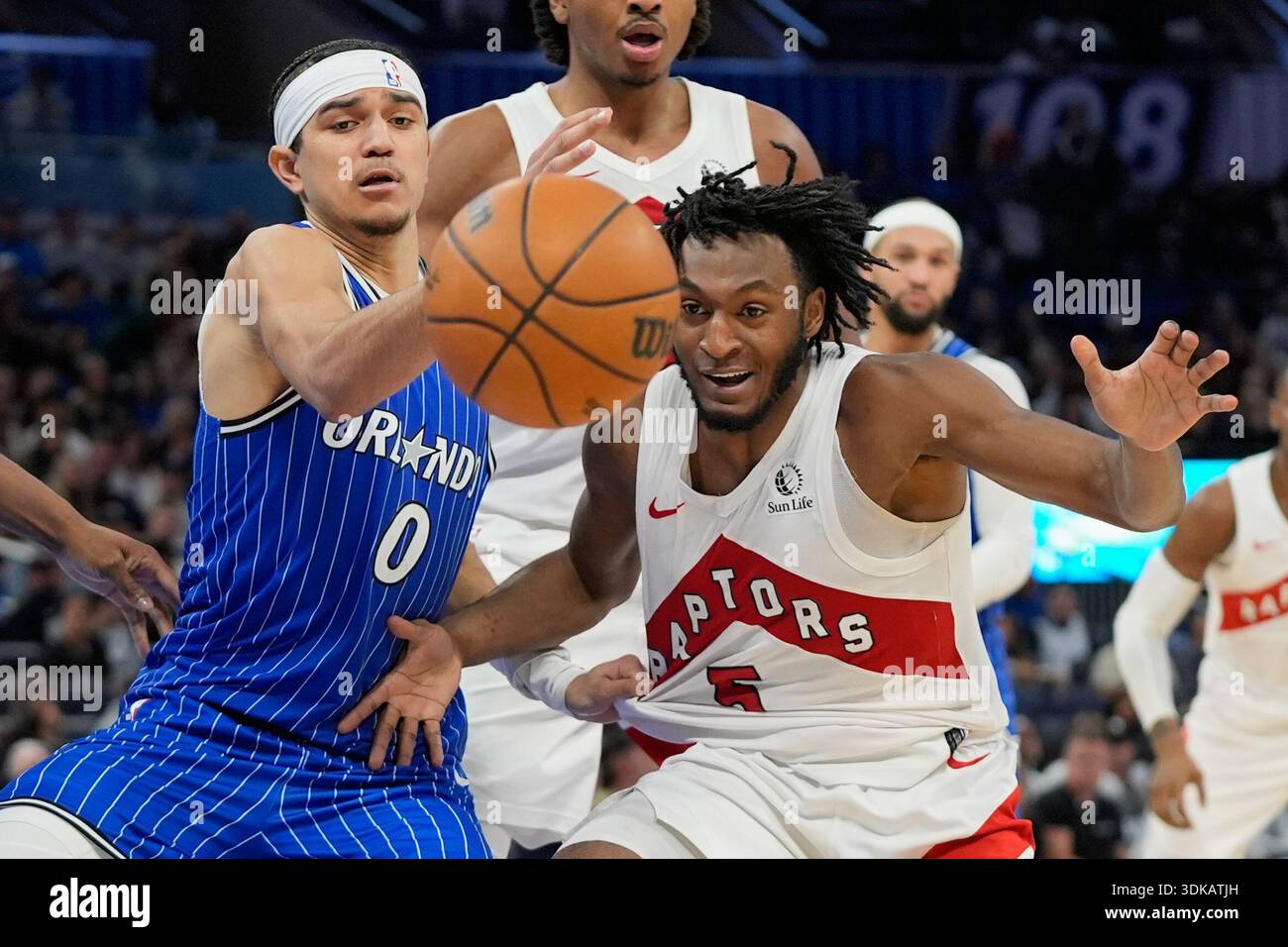 Toronto Raptors guard Immanuel Quickley, right, loses control of the ...