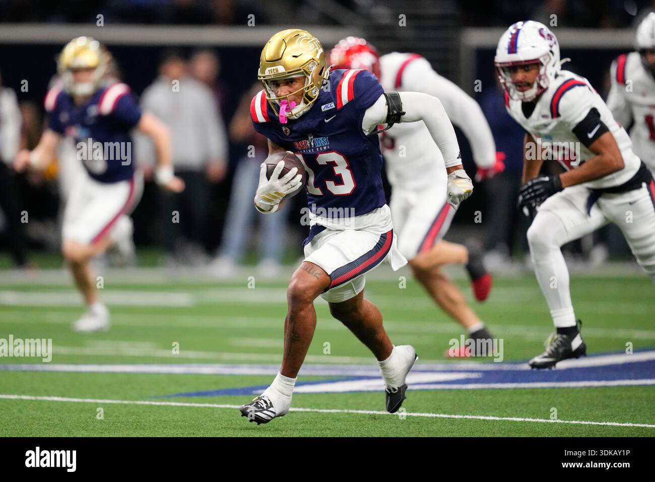 West's Eric Rivers (13), of Georgia Tech, runs the ball during the East ...