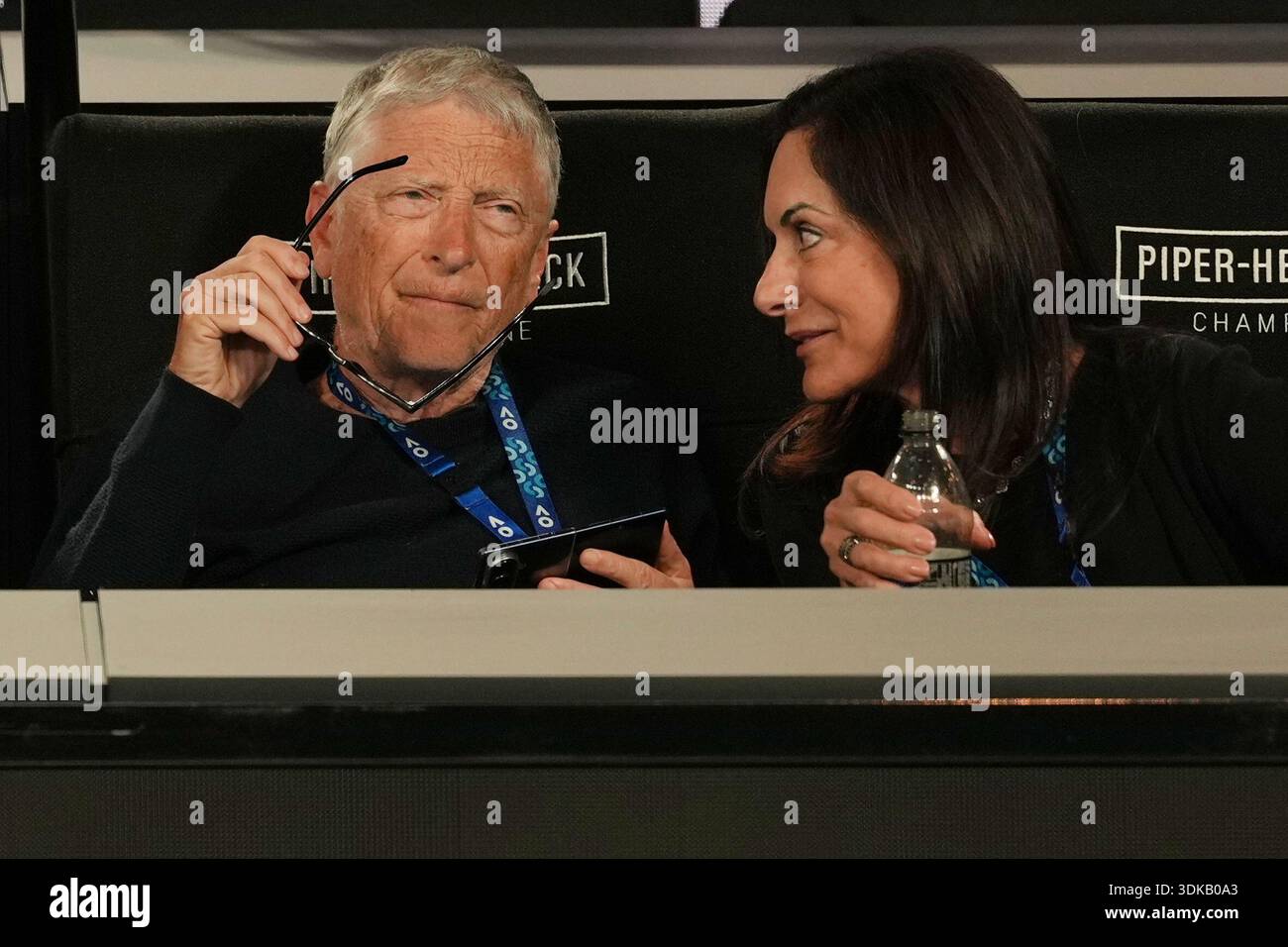 Bill Gates and Paula Hurd watch the men's doubles final at the ...