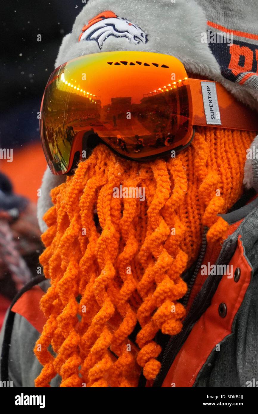 A Denver Broncos fan watches during an NFL football game against the ...