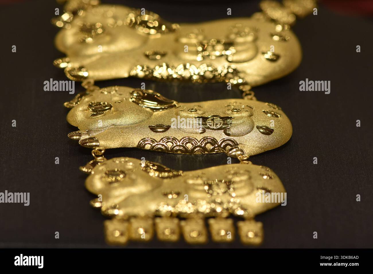 Gold jewelry being photographed in a gold shop in Fuyang City, Anhui ...