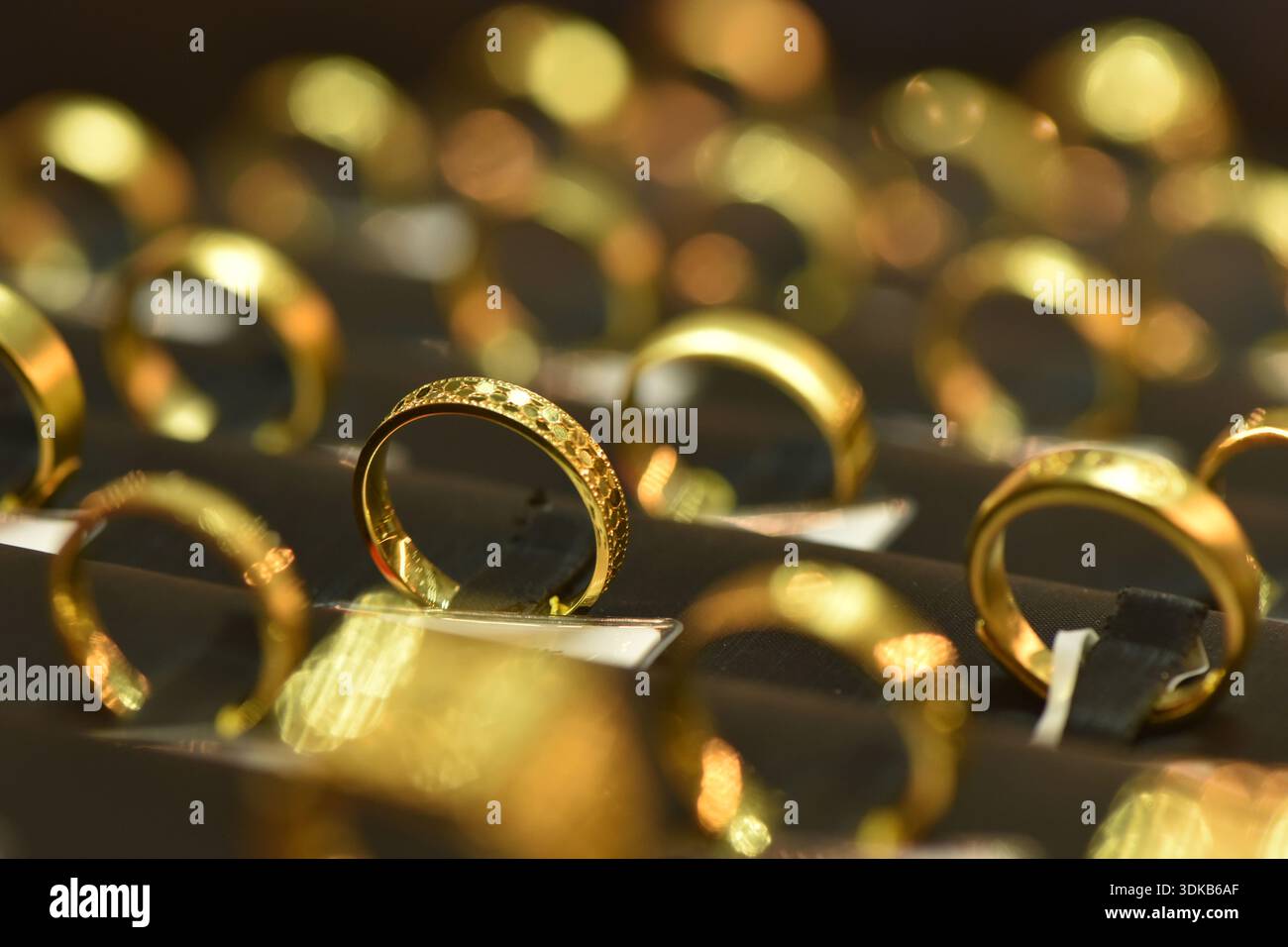 Gold jewelry being photographed in a gold shop in Fuyang City, Anhui ...