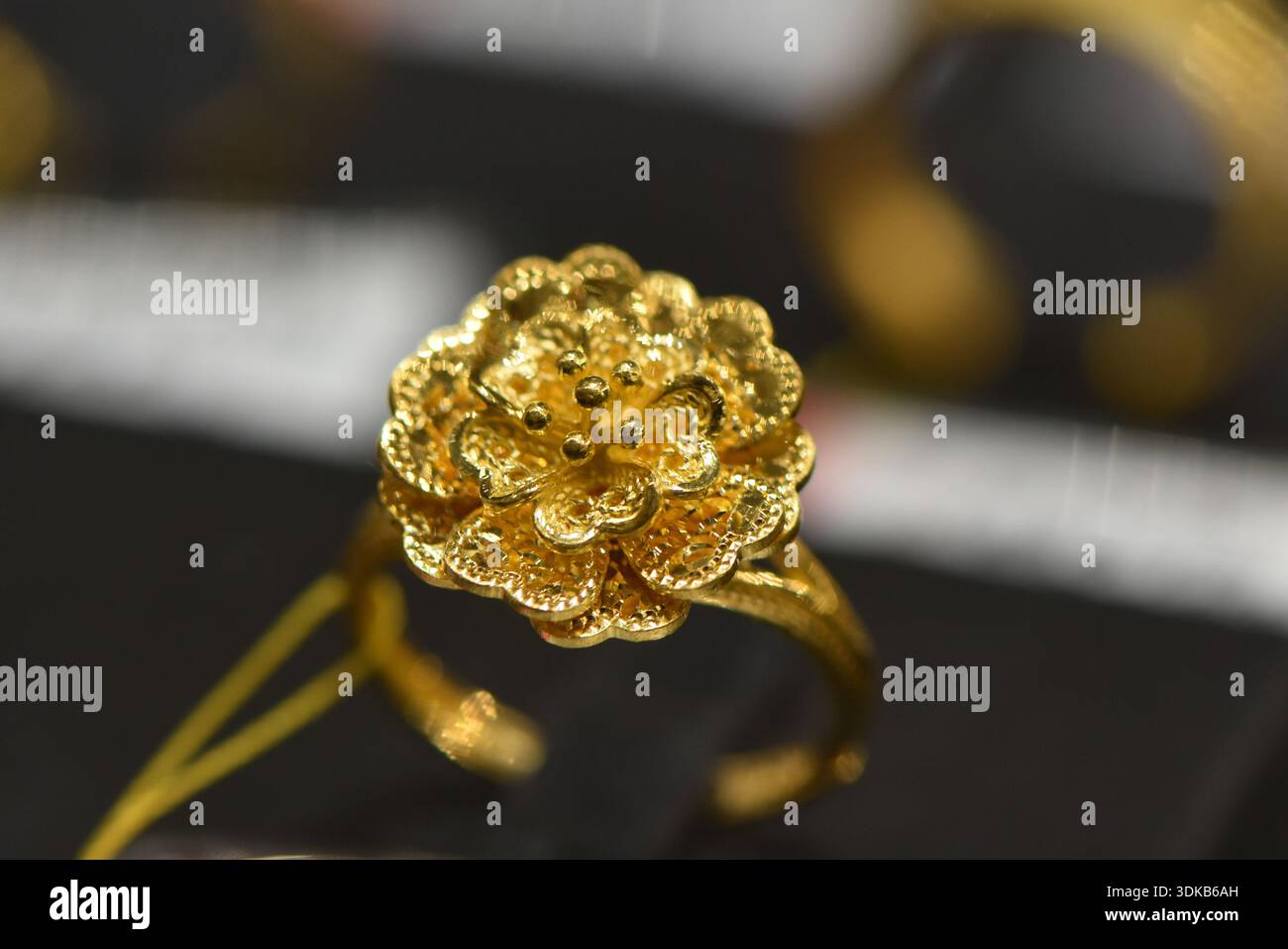 Gold jewelry being photographed in a gold shop in Fuyang City, Anhui ...