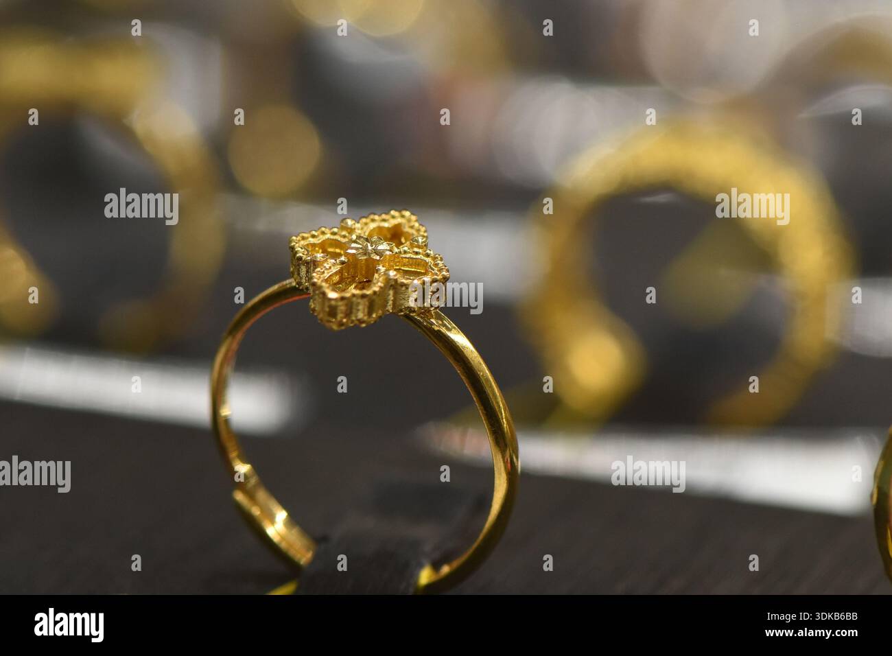 Gold jewelry being photographed in a gold shop in Fuyang City, Anhui ...