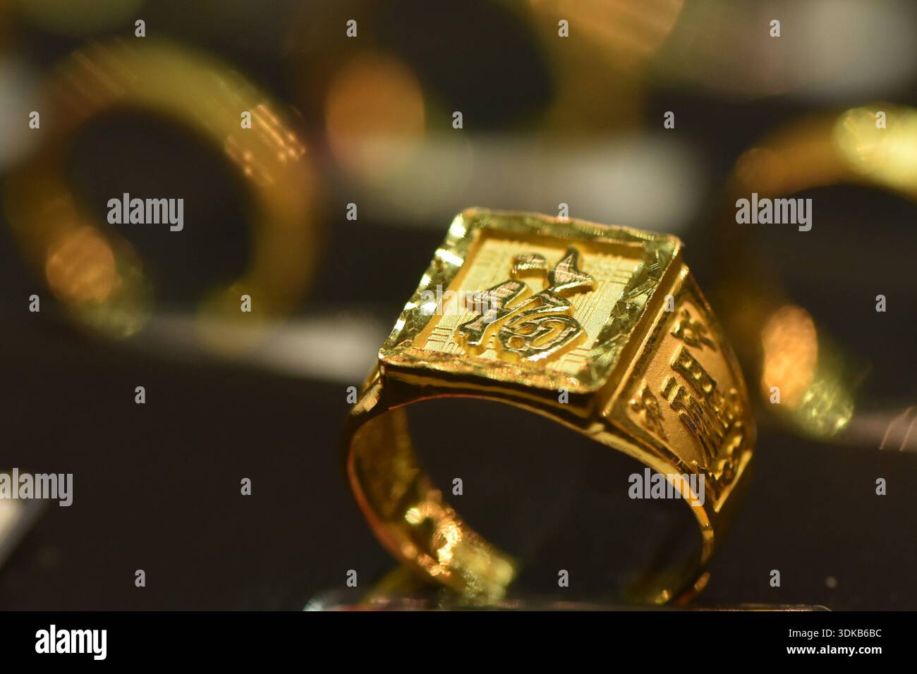 Gold jewelry being photographed in a gold shop in Fuyang City, Anhui ...