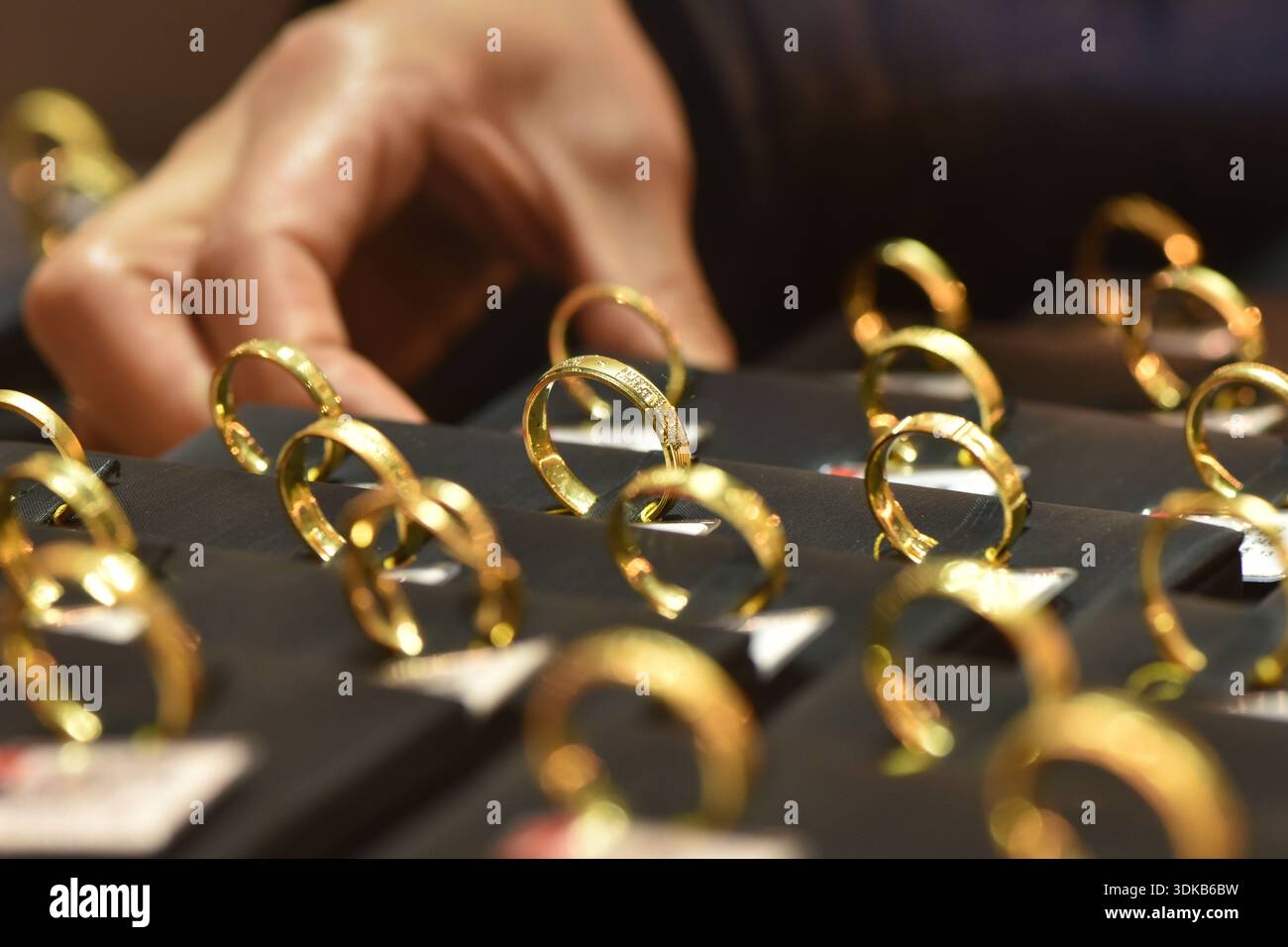 Gold jewelry being photographed in a gold shop in Fuyang City, Anhui ...