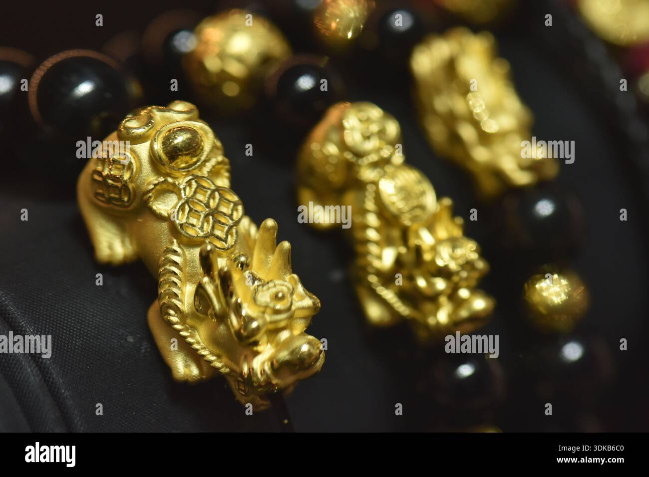 Gold jewelry being photographed in a gold shop in Fuyang City, Anhui ...