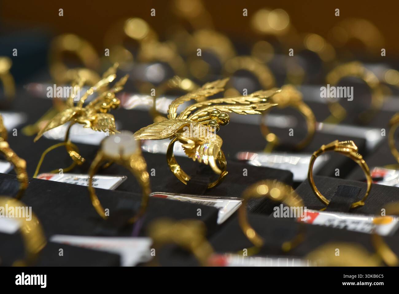 Gold jewelry being photographed in a gold shop in Fuyang City, Anhui ...