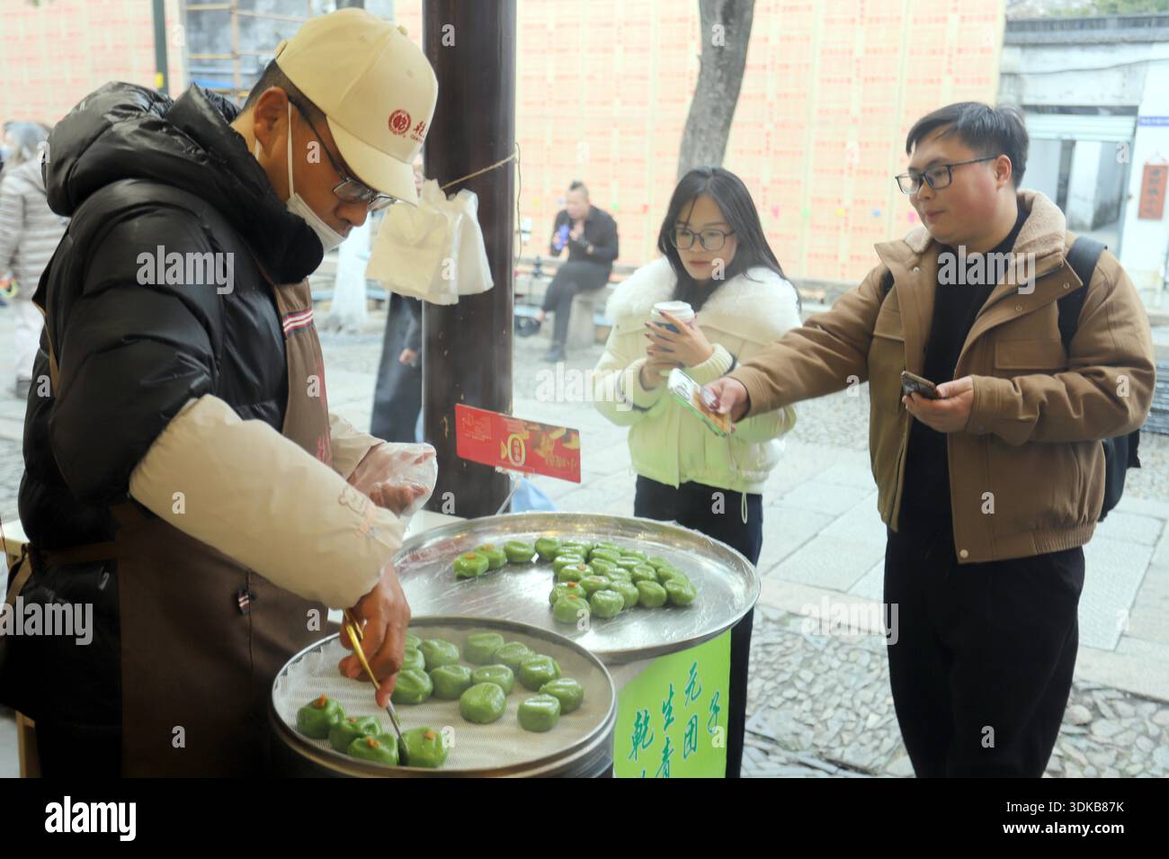 Freshly made green rice balls, a seasonal spring snack, attract ...