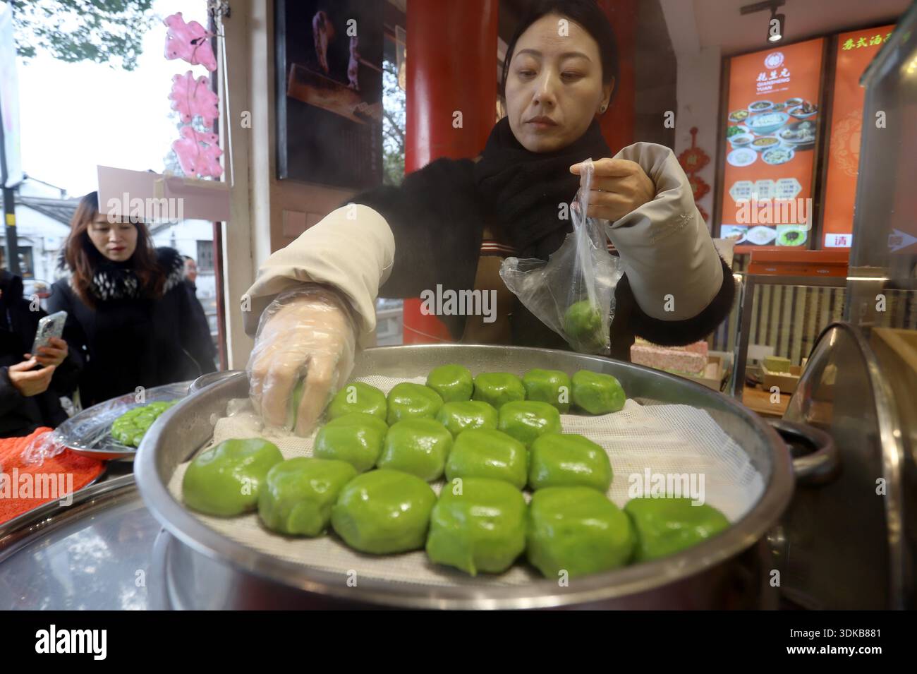 Freshly made green rice balls, a seasonal spring snack, attract ...