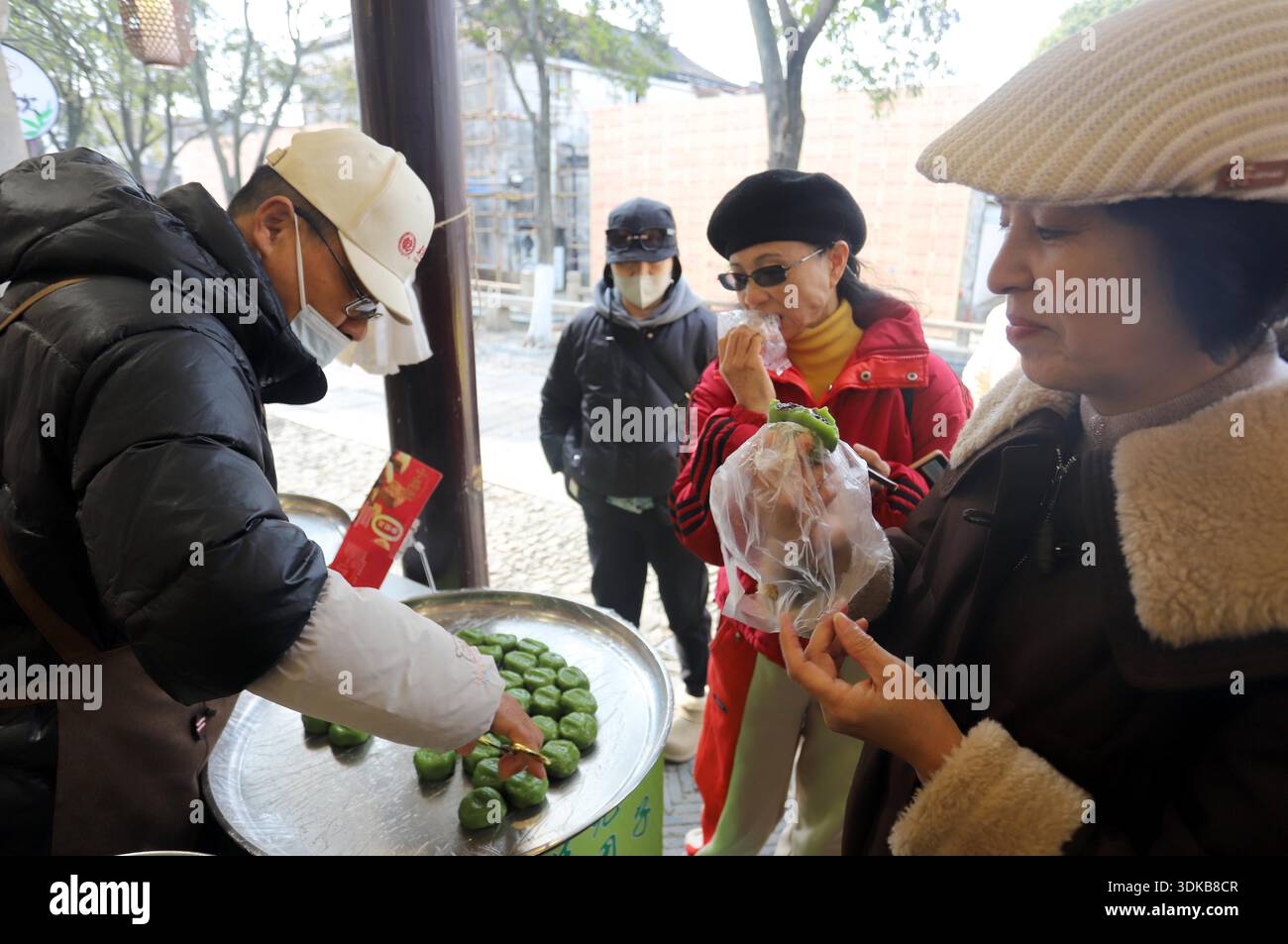 Freshly made green rice balls, a seasonal spring snack, attract ...