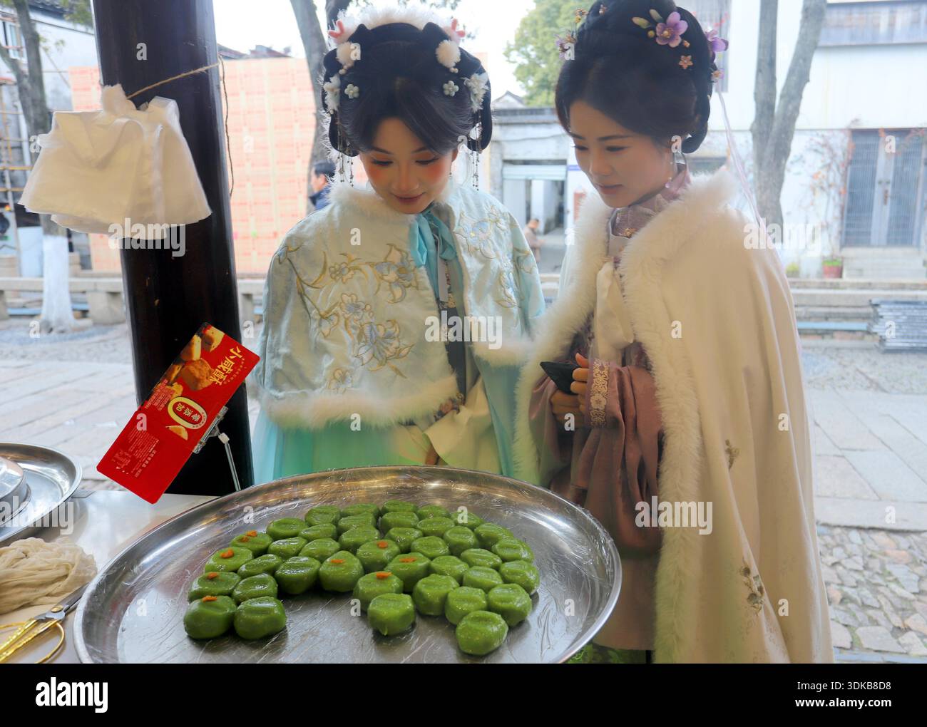 Freshly made green rice balls, a seasonal spring snack, attract ...