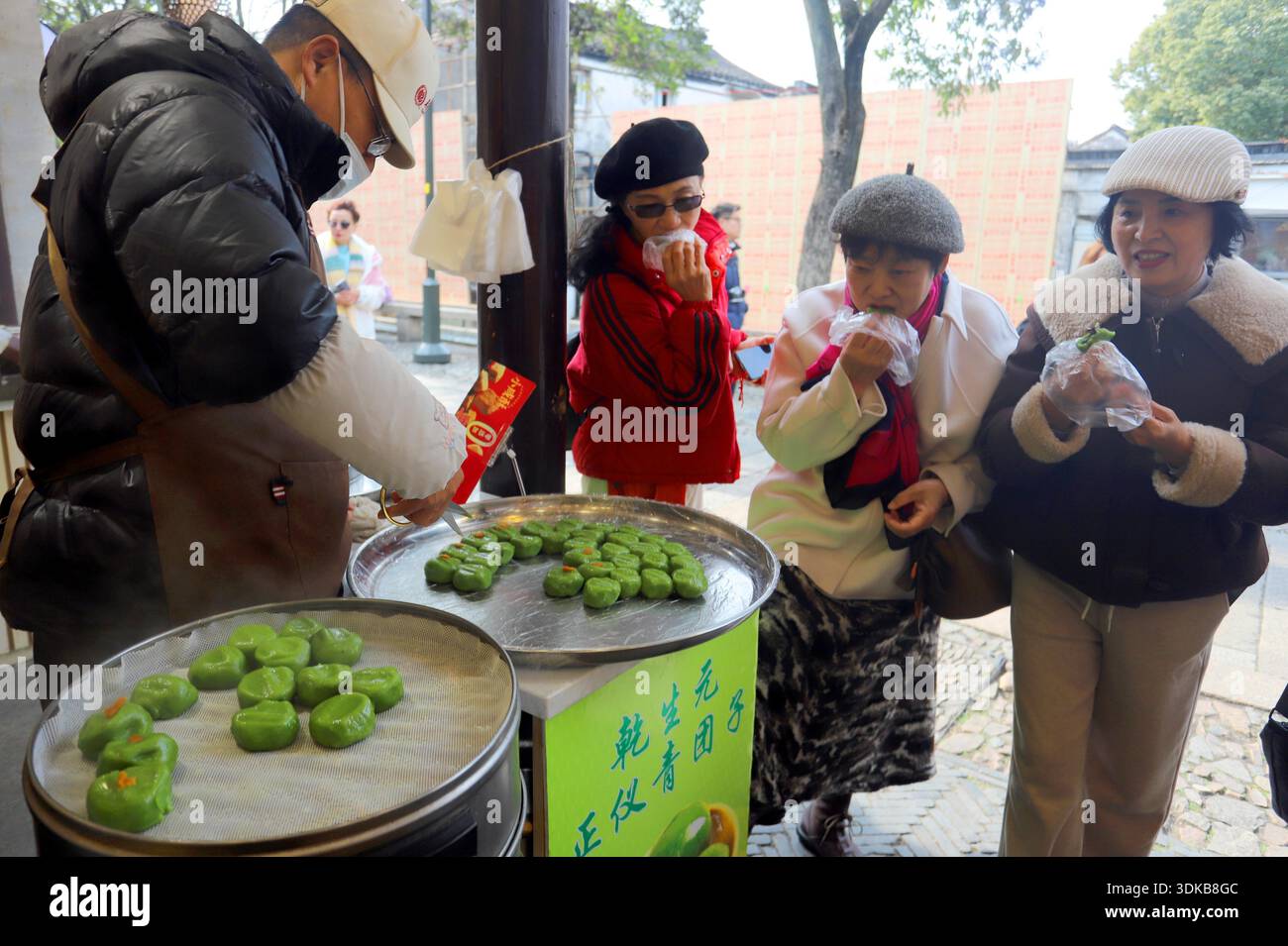 Freshly made green rice balls, a seasonal spring snack, attract ...