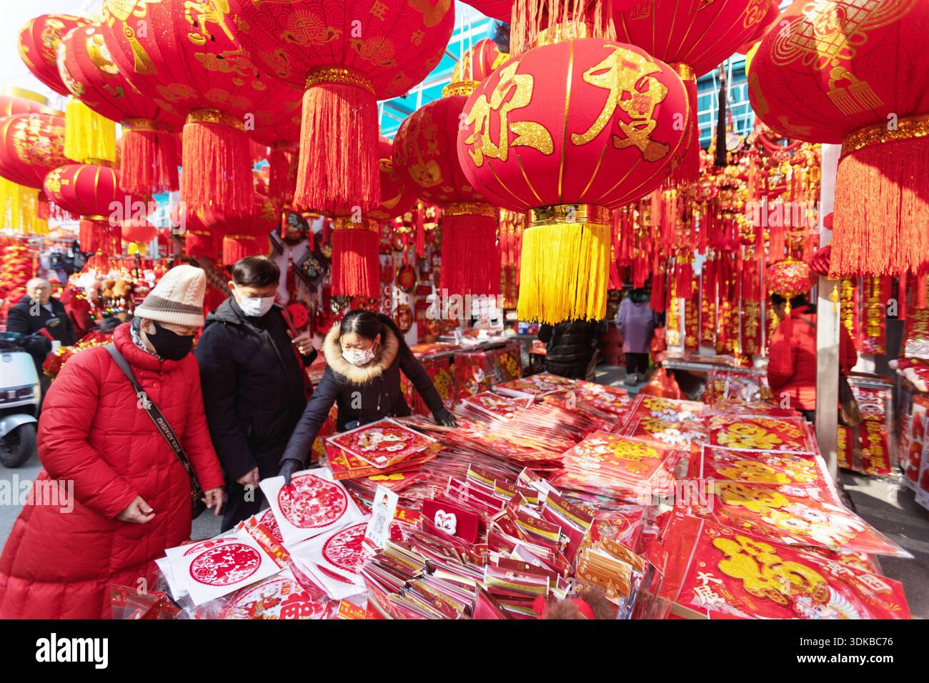 Citizens select New Year decorations at a supermarket in Nanjing City ...