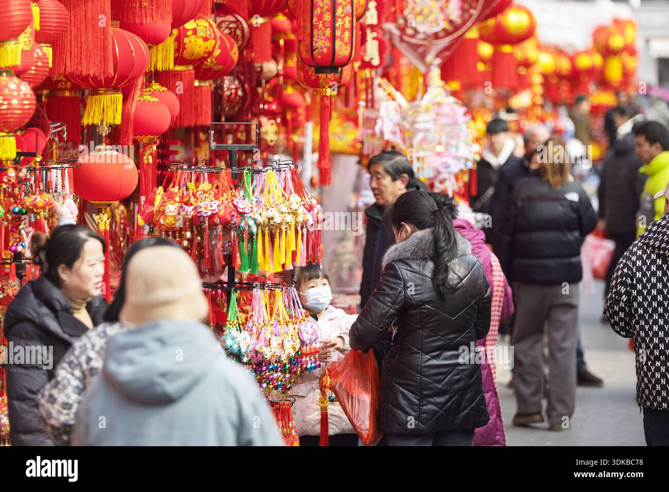 Citizens select New Year decorations at a supermarket in Nanjing City ...