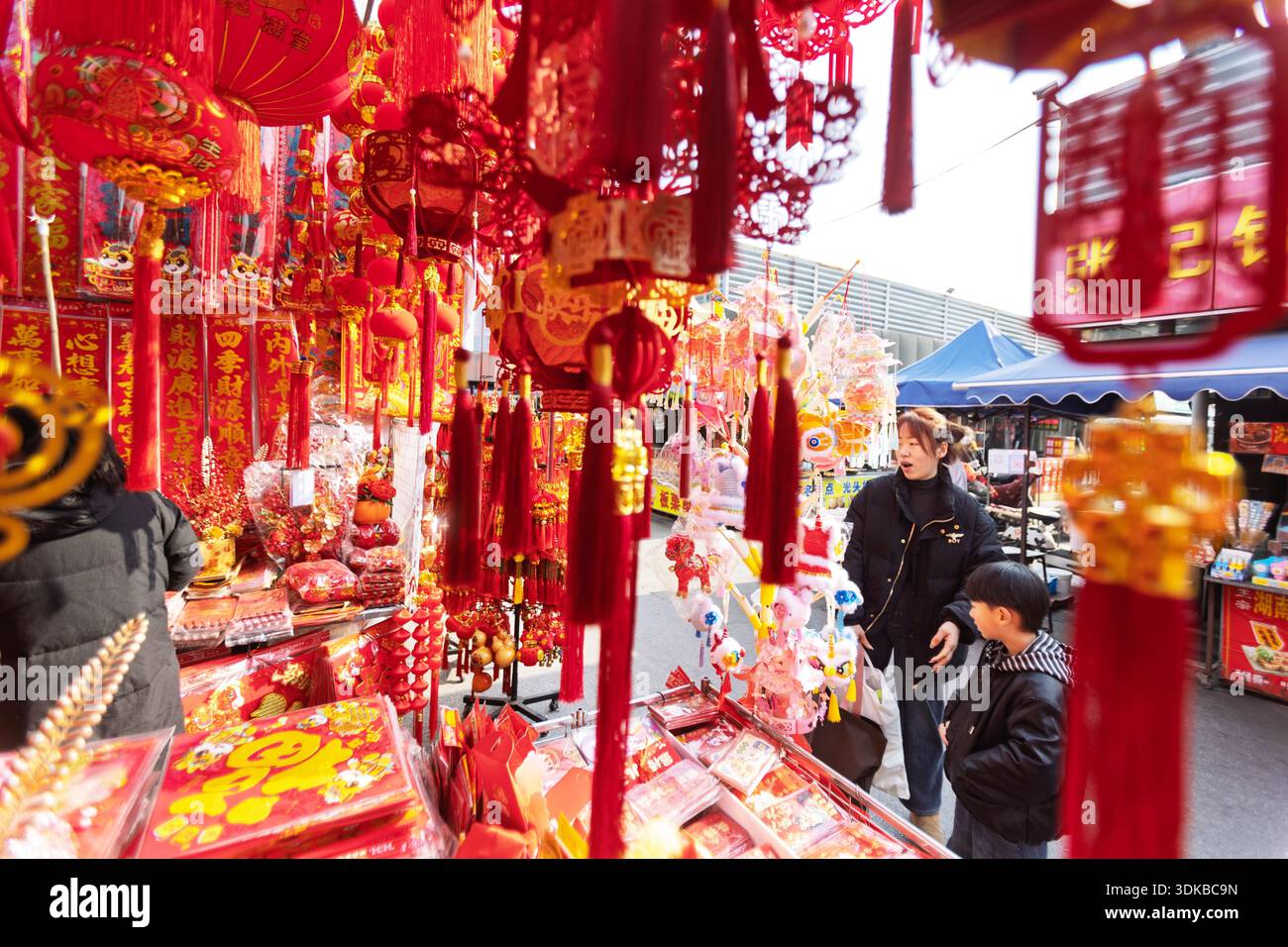 Citizens select New Year decorations at a supermarket in Nanjing City ...