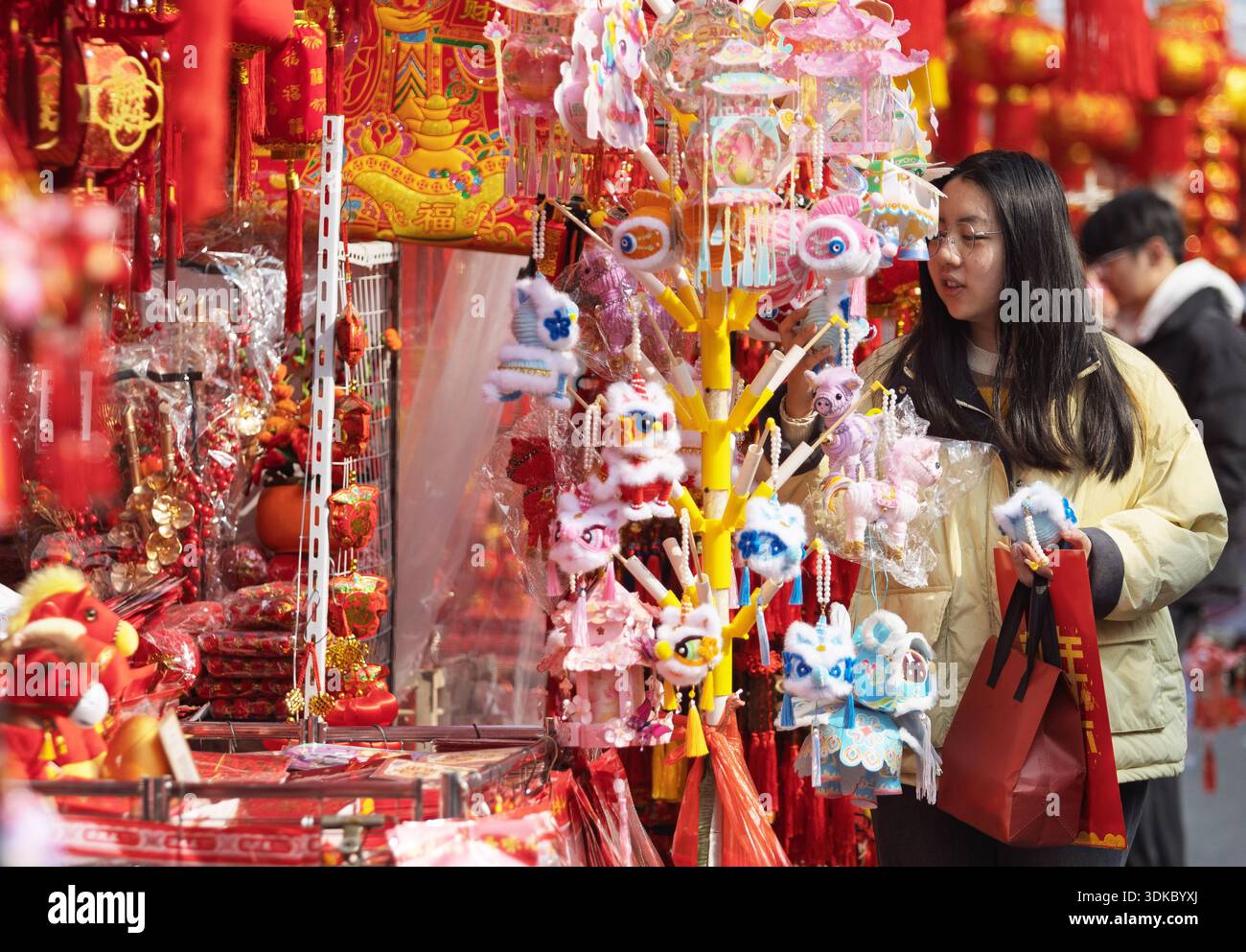 Citizens select New Year decorations at a supermarket in Nanjing City ...