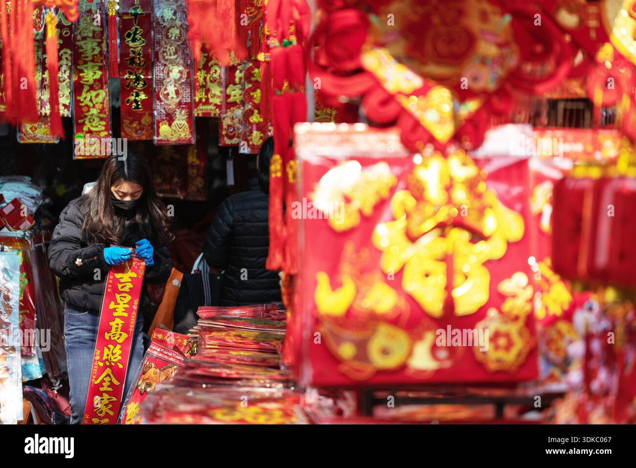 Citizens select New Year decorations at a supermarket in Nanjing City ...