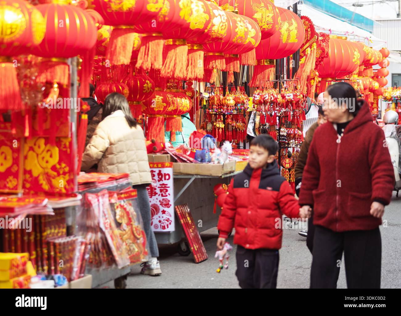 Citizens select New Year decorations at a supermarket in Nanjing City ...