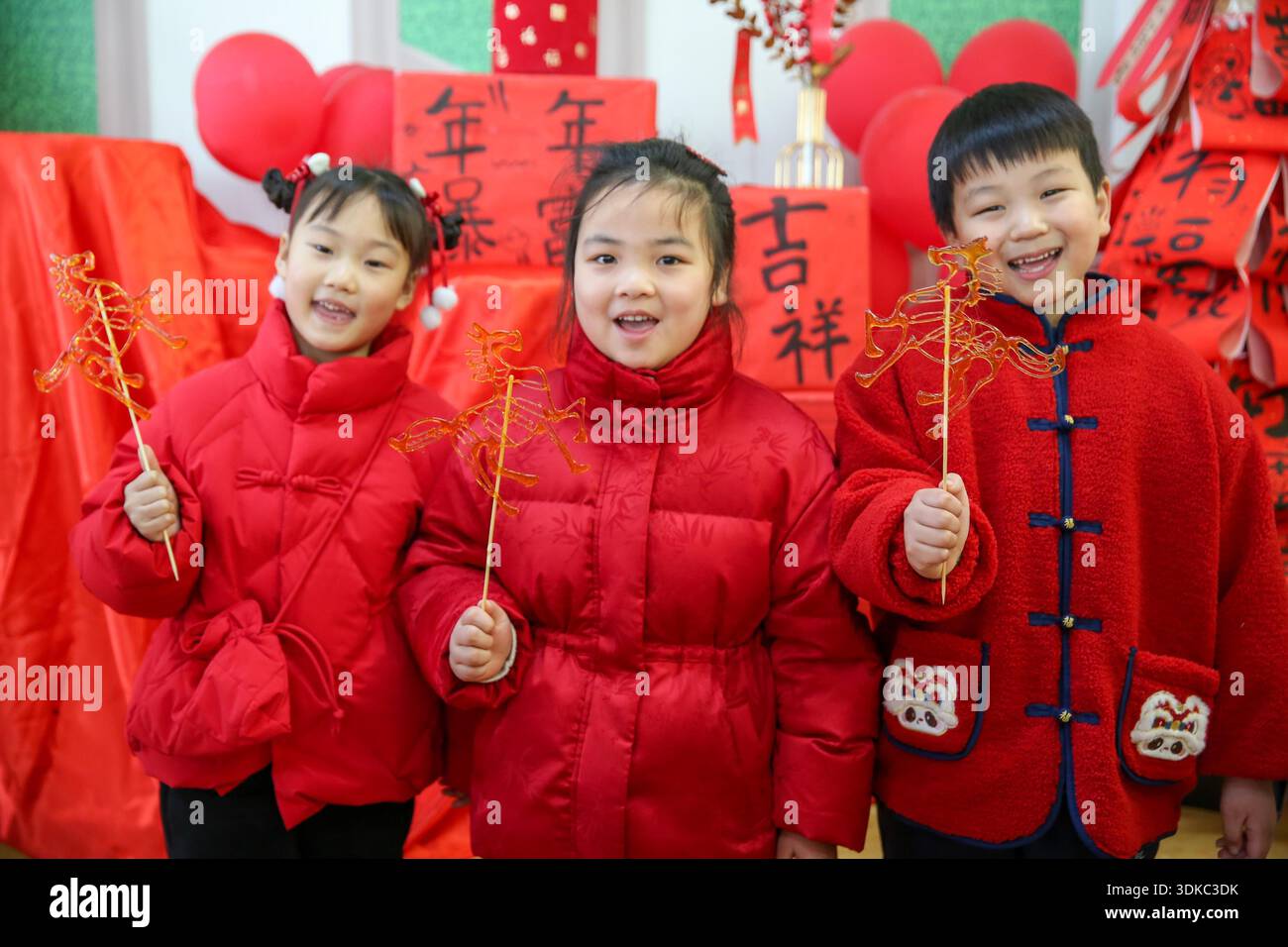 Children learn to make zodiac horse sugar paintings at a kindergarten ...