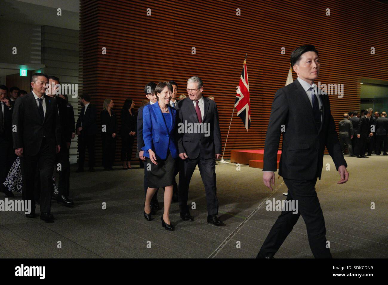 British Prime Minister Keir Starmer, right, attends a ceremonial guard ...