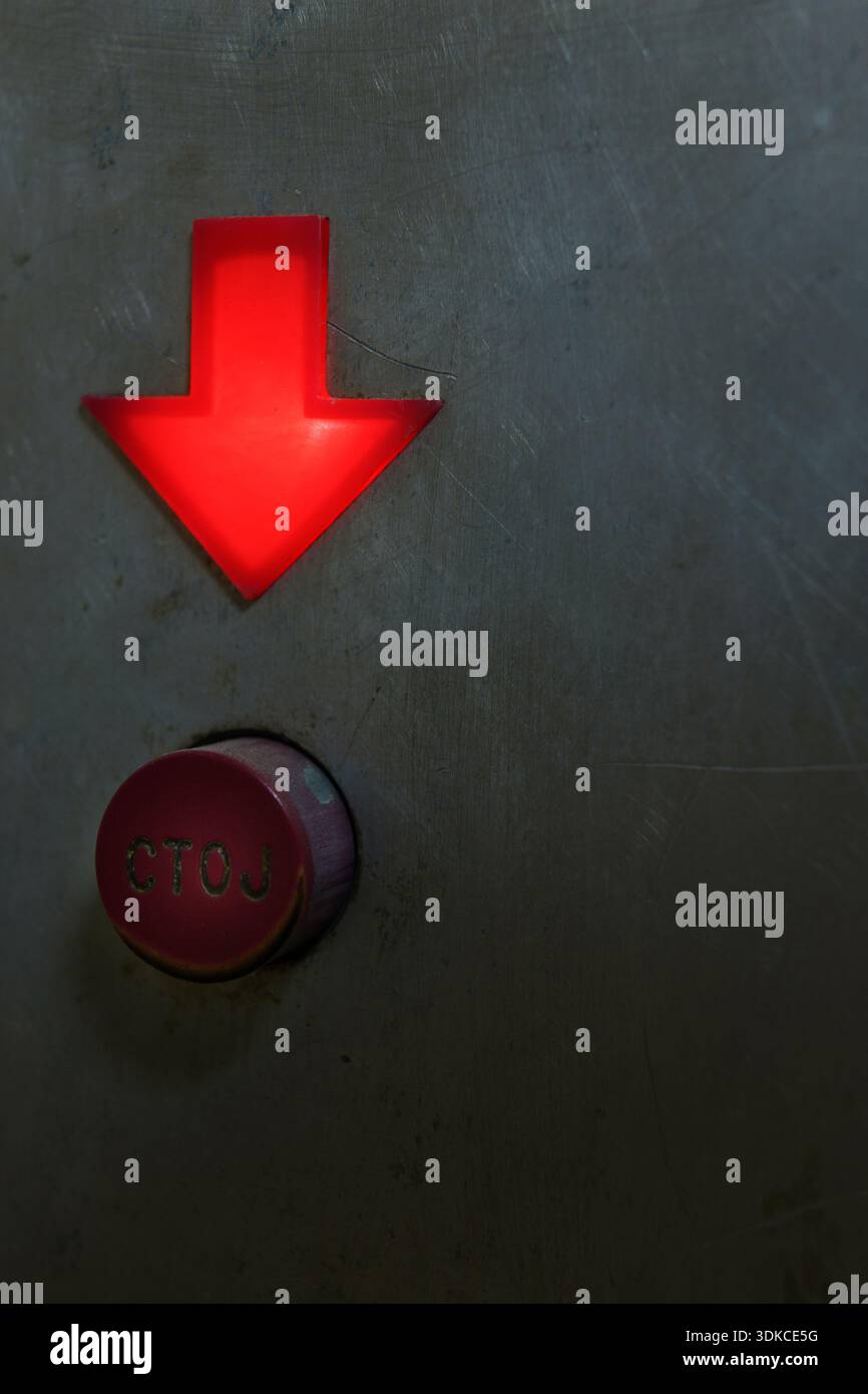 Plastic red down arrow and stop button in Cyrillic, details of an old ...