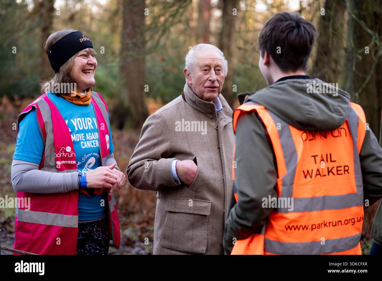 King Charles III and volunteer Sarah Byatt (left) at a marshal point ...