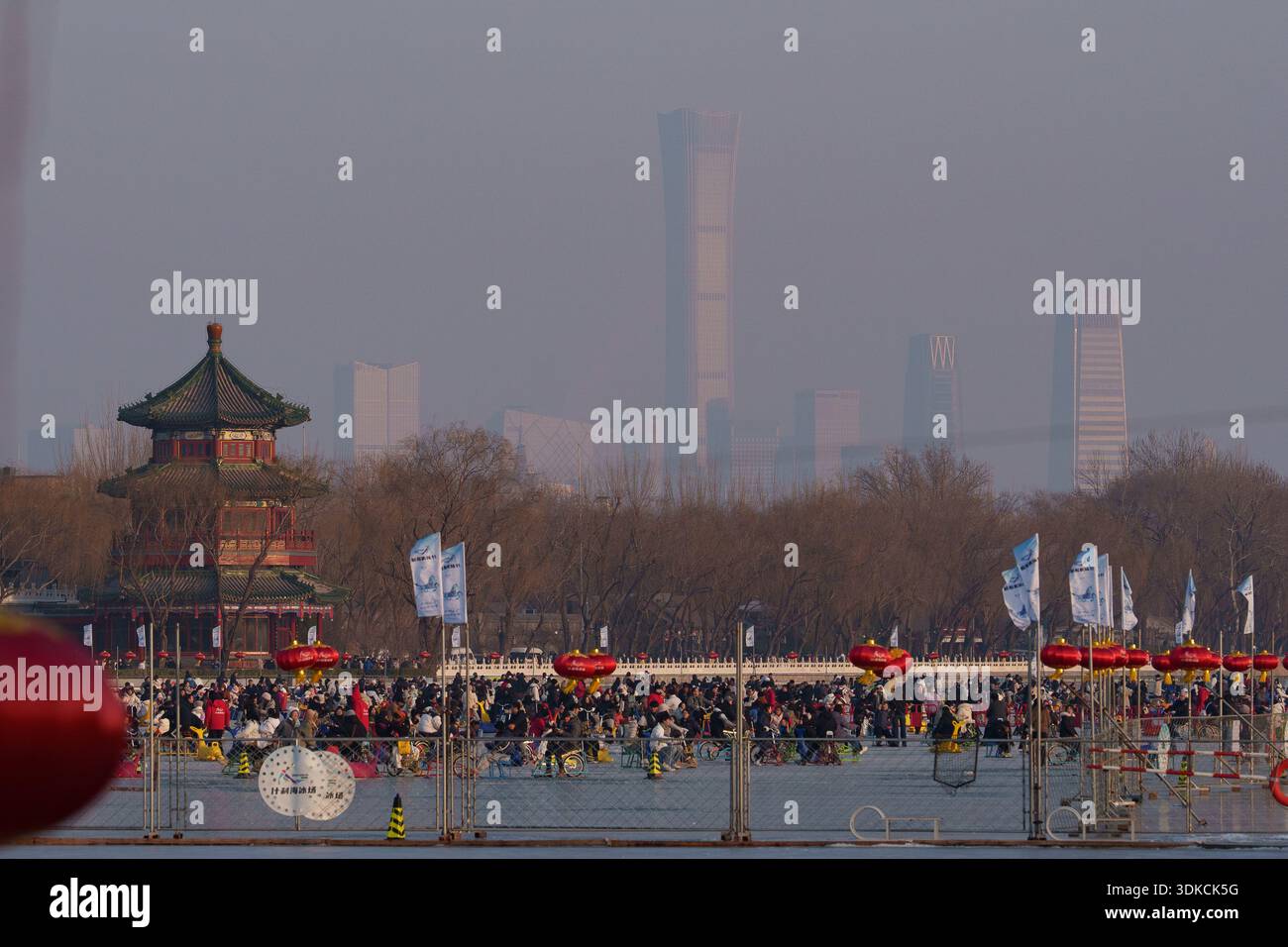 Peoples ice skating on frozen Shichahai with CBD in the background in ...